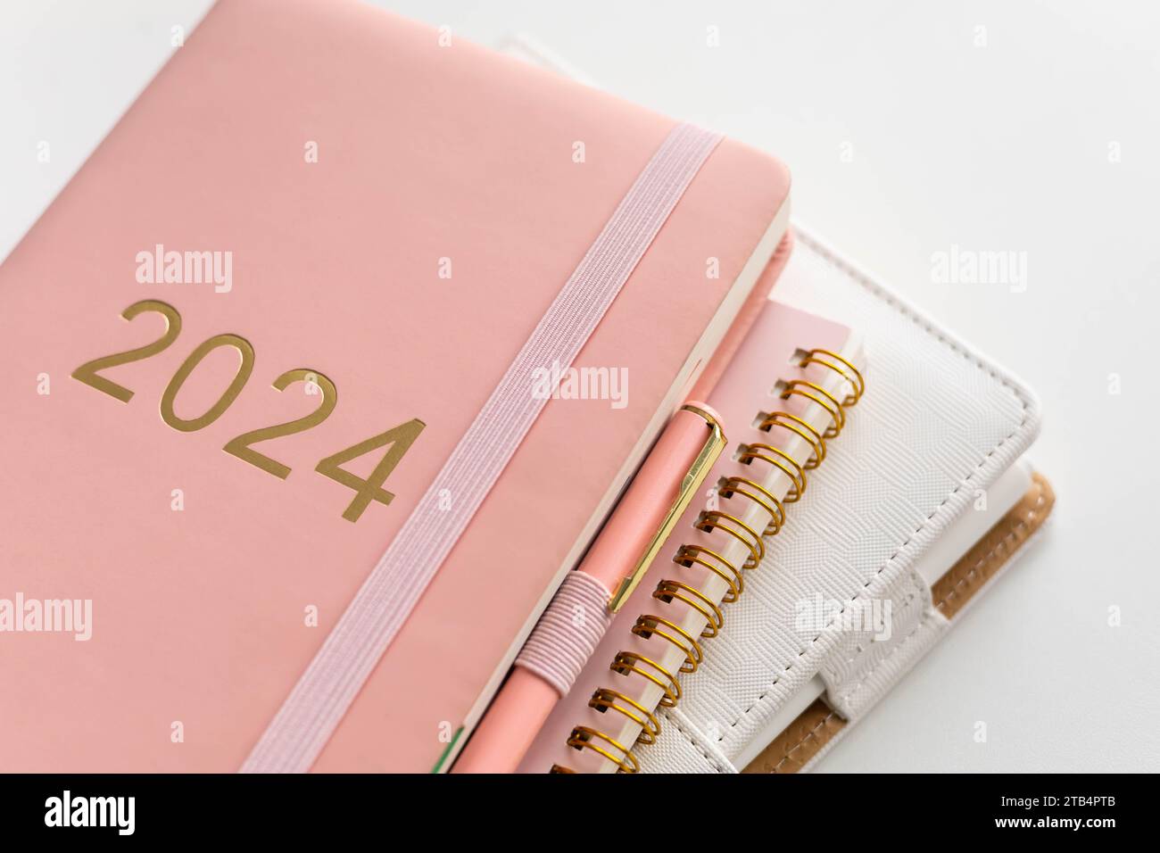 Pink coral colored diary for the year 2024 and many other diaries, pen ...