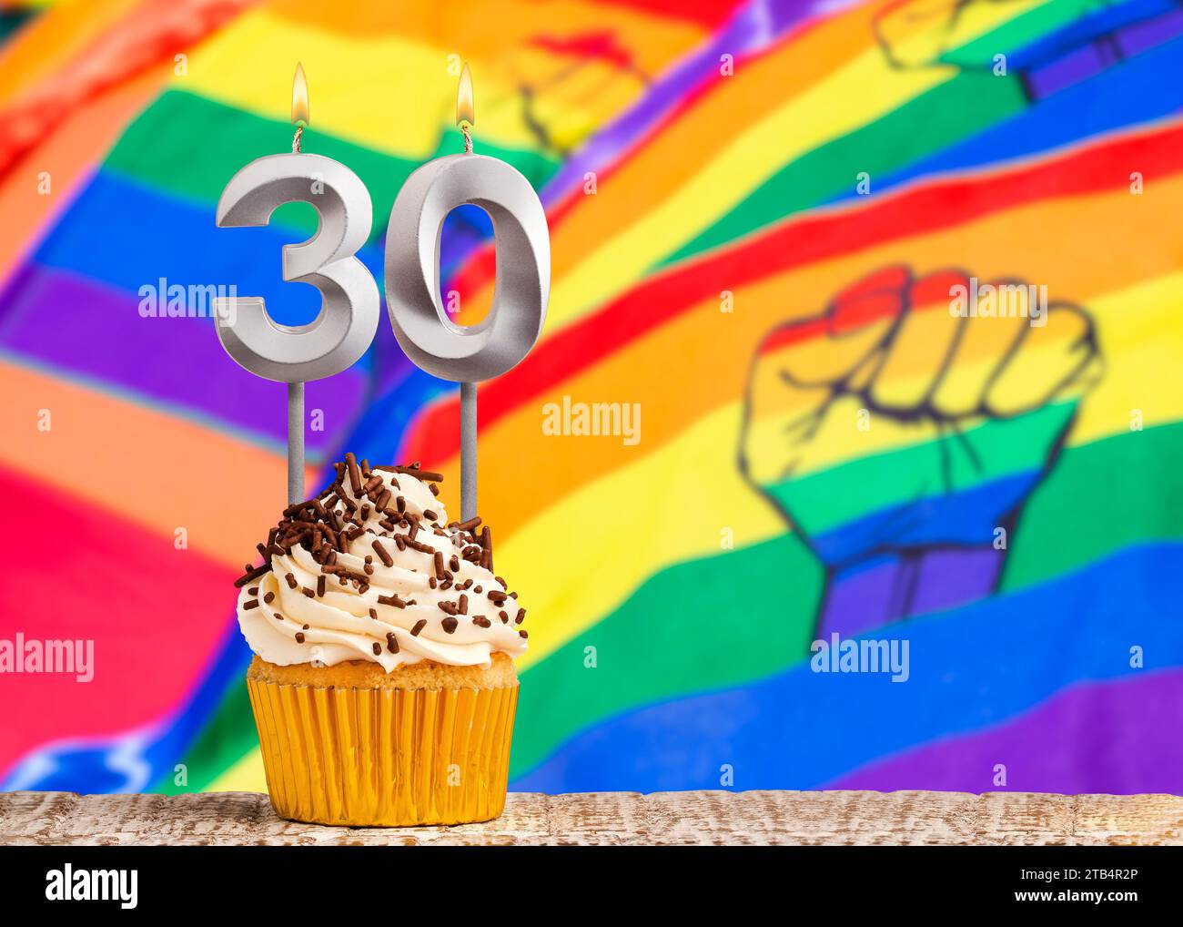 Birthday candle number 30 - Gay march flag background Stock Photo - Alamy