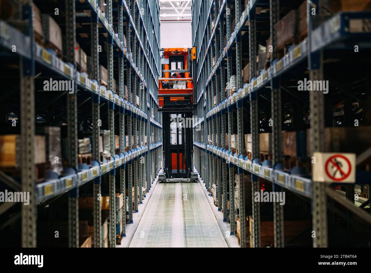 Modern warehouse interior with shelves and boxes and forklift loader ...