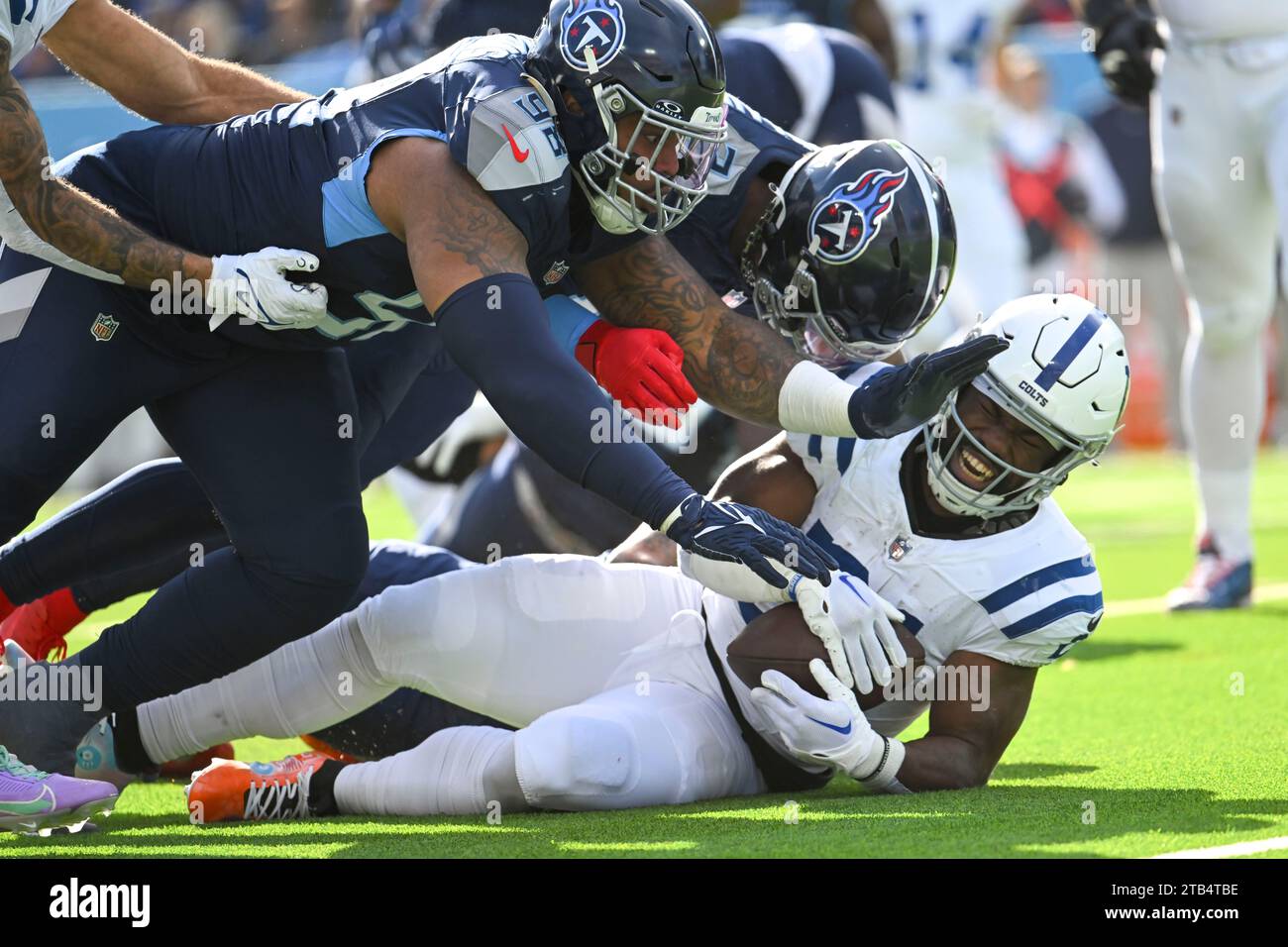 Indianapolis Colts running back Zack Moss (21) is tacled by Tennessee ...
