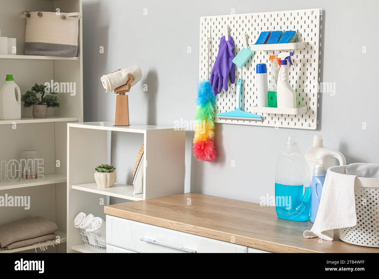 Interior of laundry room with pegboard and cleaning supplies Stock ...