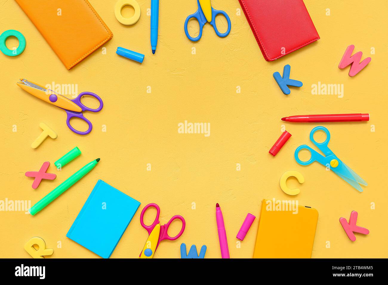 Frame made of colorful stationery on yellow background Stock Photo - Alamy