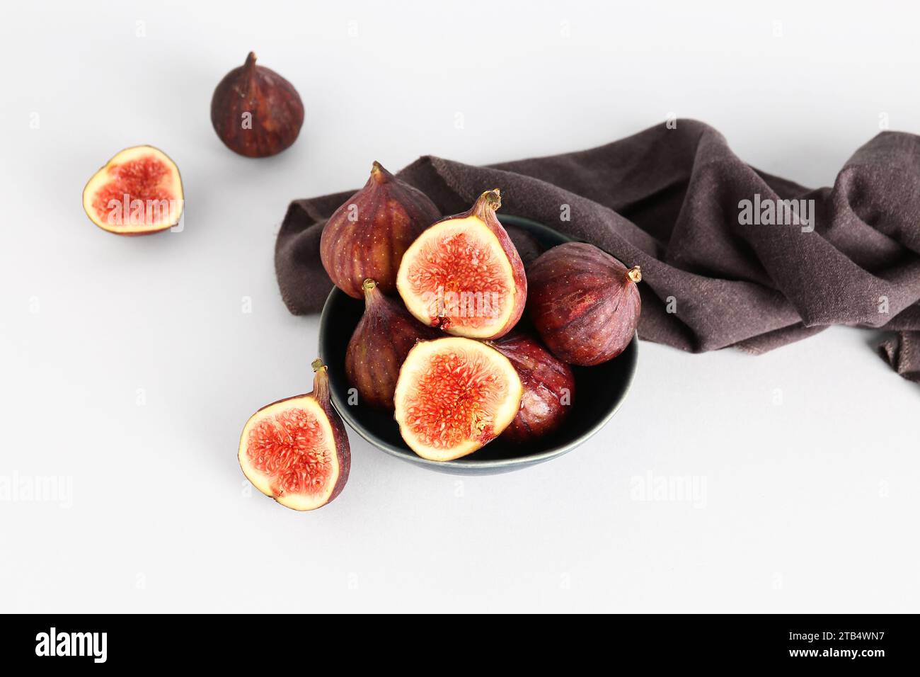 Bowl with fresh ripe figs on white background Stock Photo - Alamy