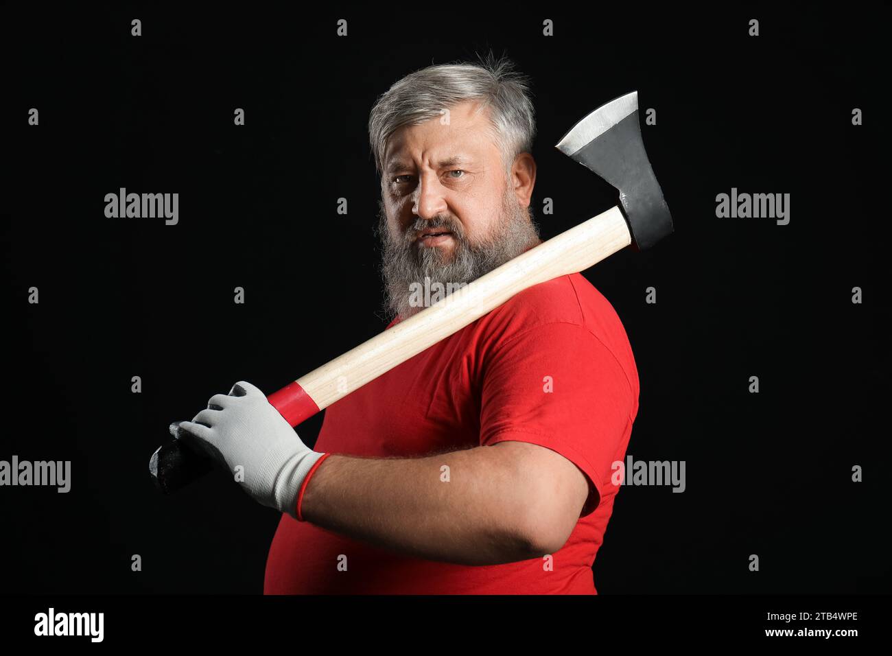 Portrait of mature lumberjack with axe on black background Stock Photo ...