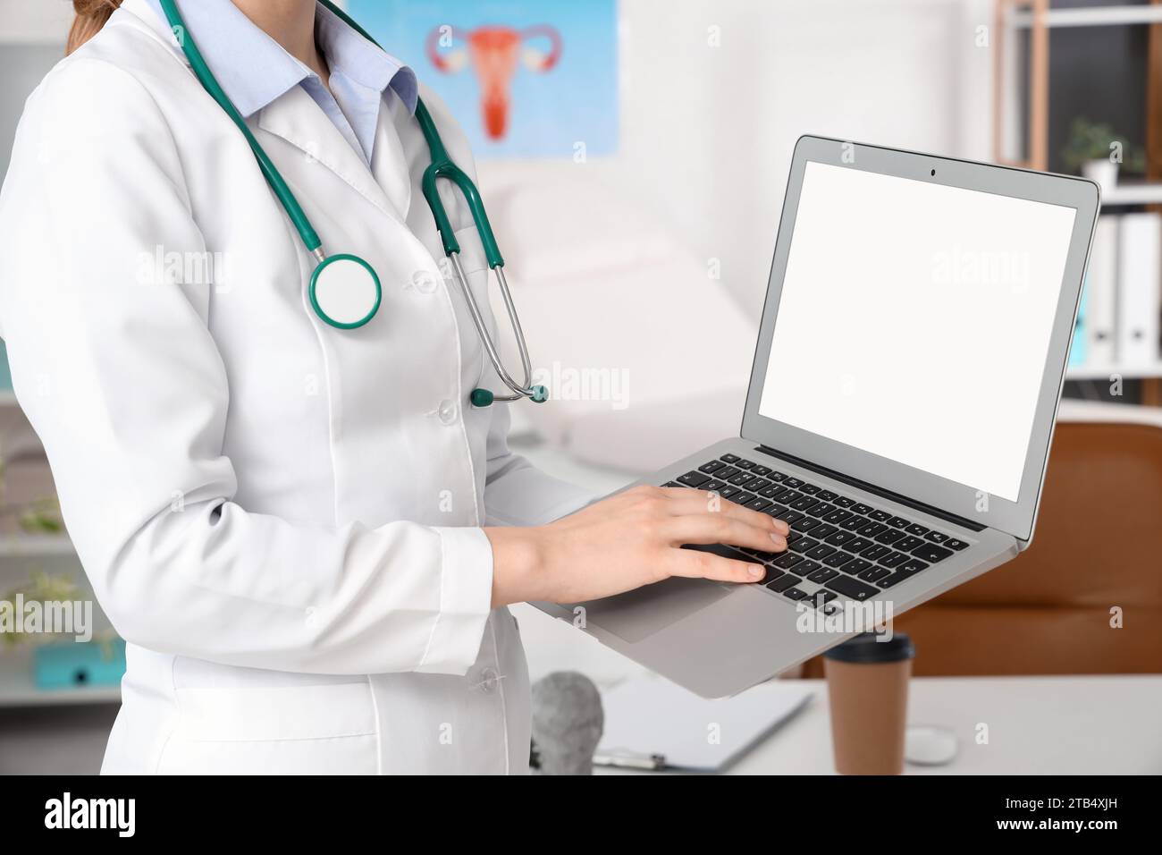Female doctor working with laptop in clinic, closeup Stock Photo - Alamy
