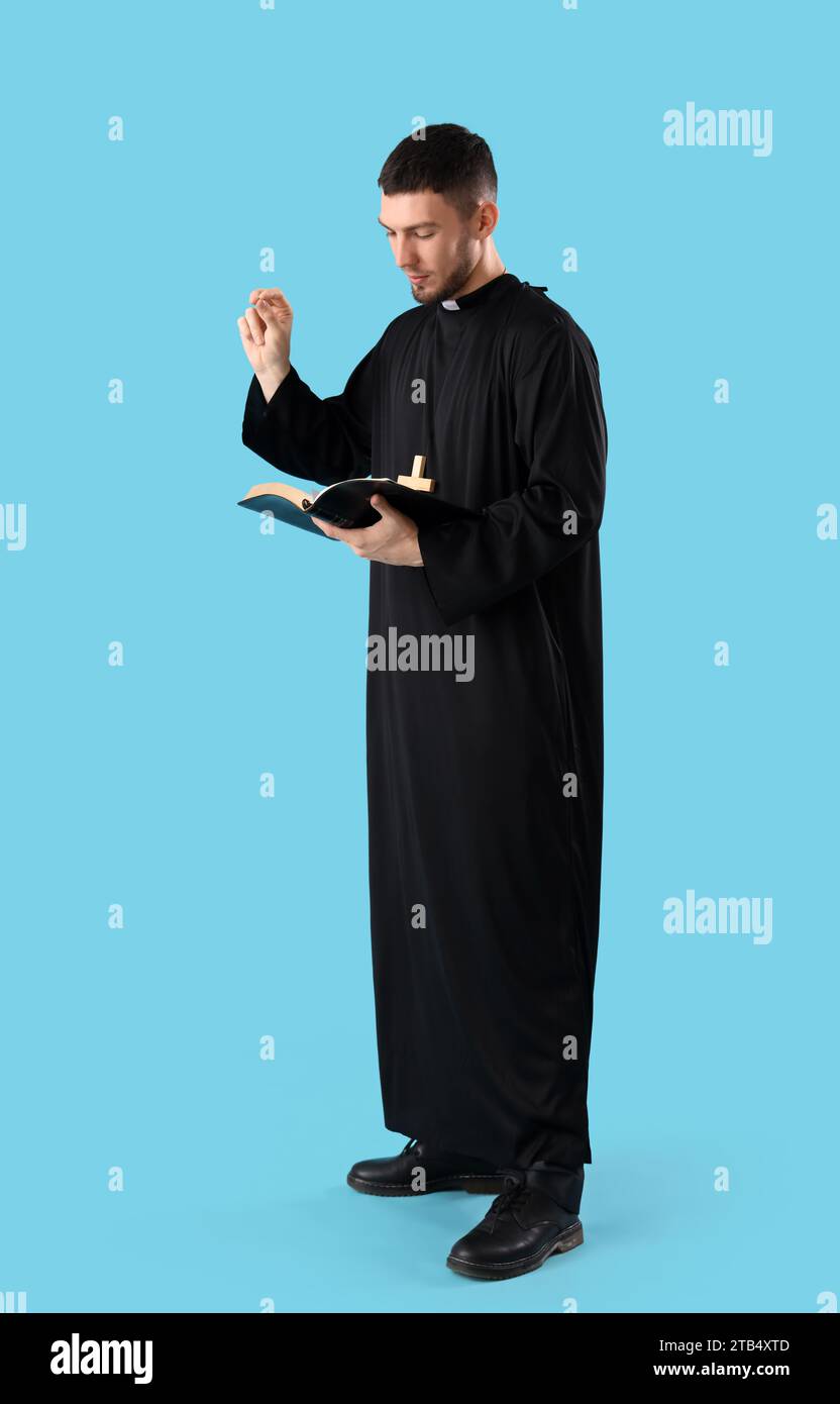 Young priest holy bible hi-res stock photography and images - Alamy