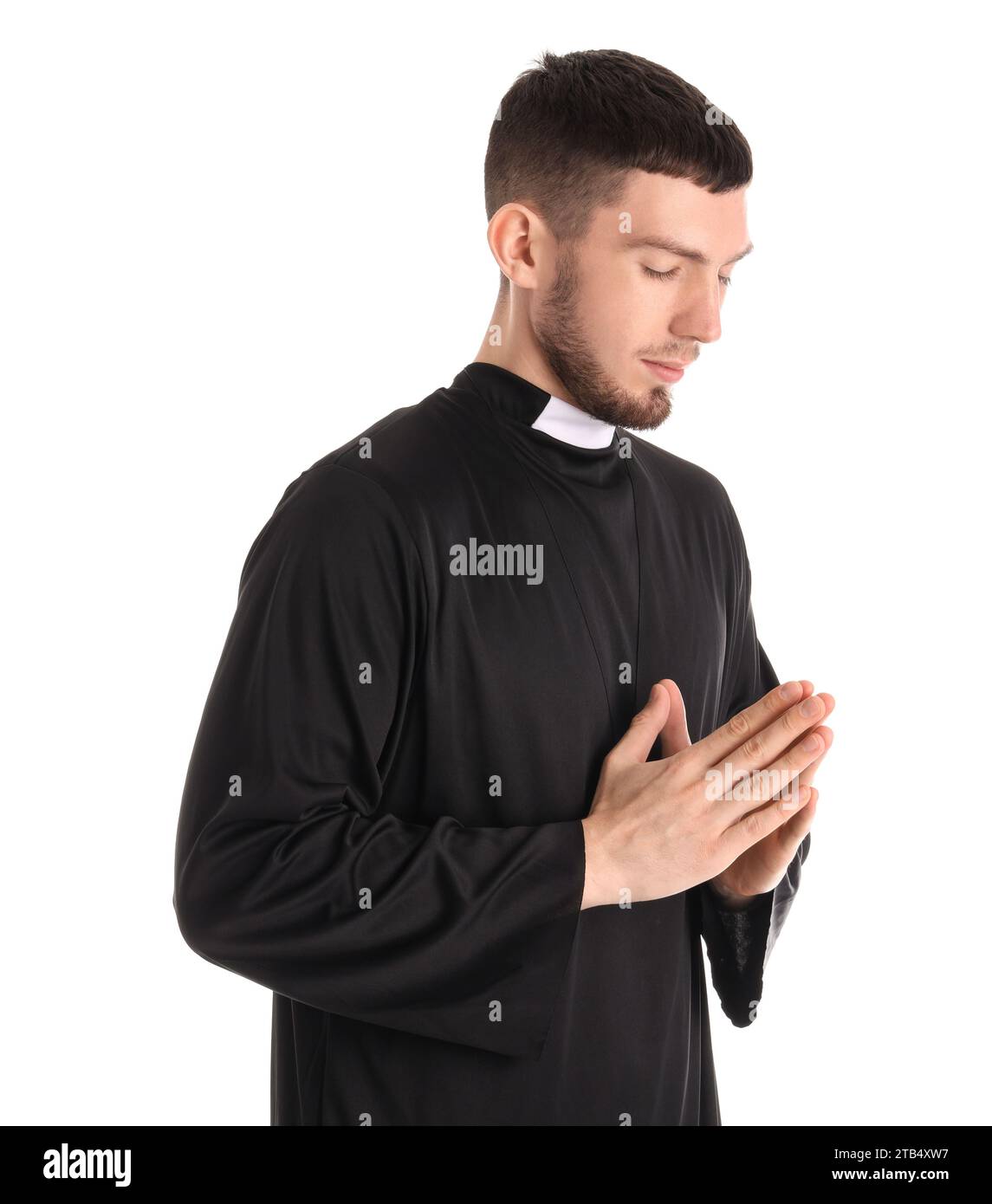 Young priest praying on white background Stock Photo - Alamy