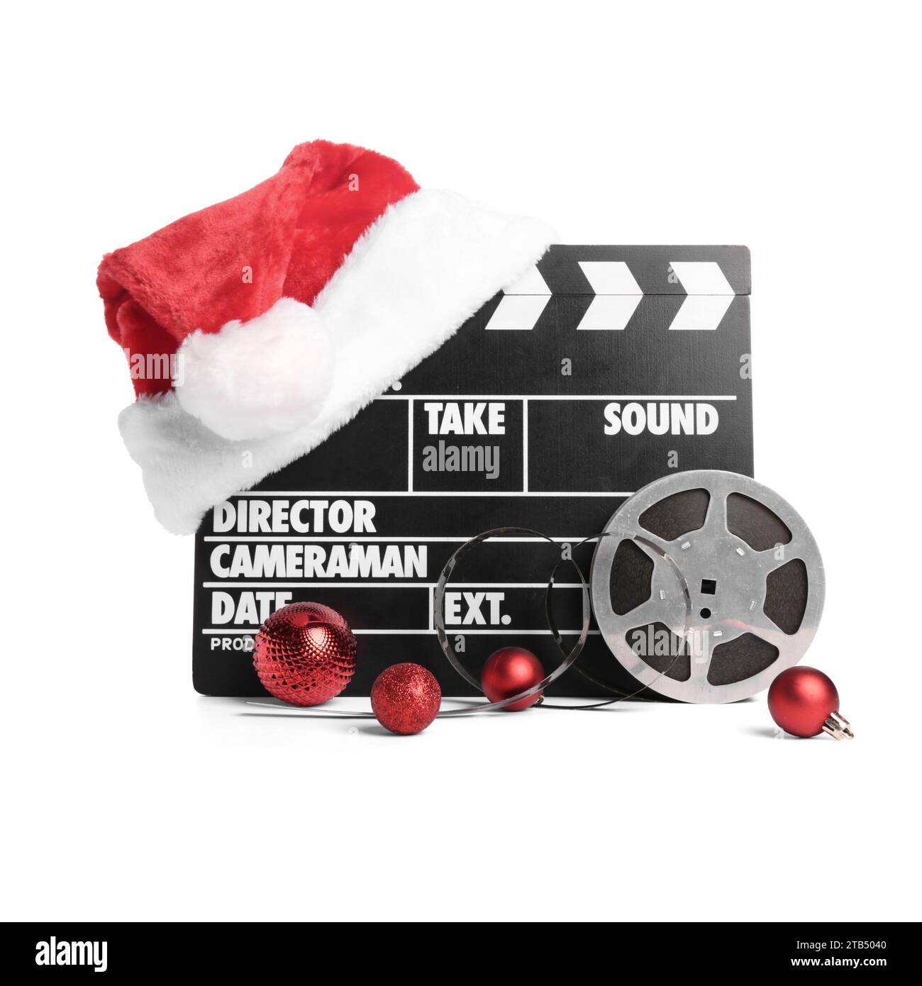 Movie clapper with film reel and Christmas decor on white background ...