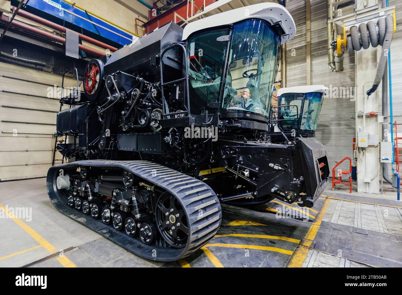 Tractor Manufacturing. Assembly line of agricultural caterpillar ...