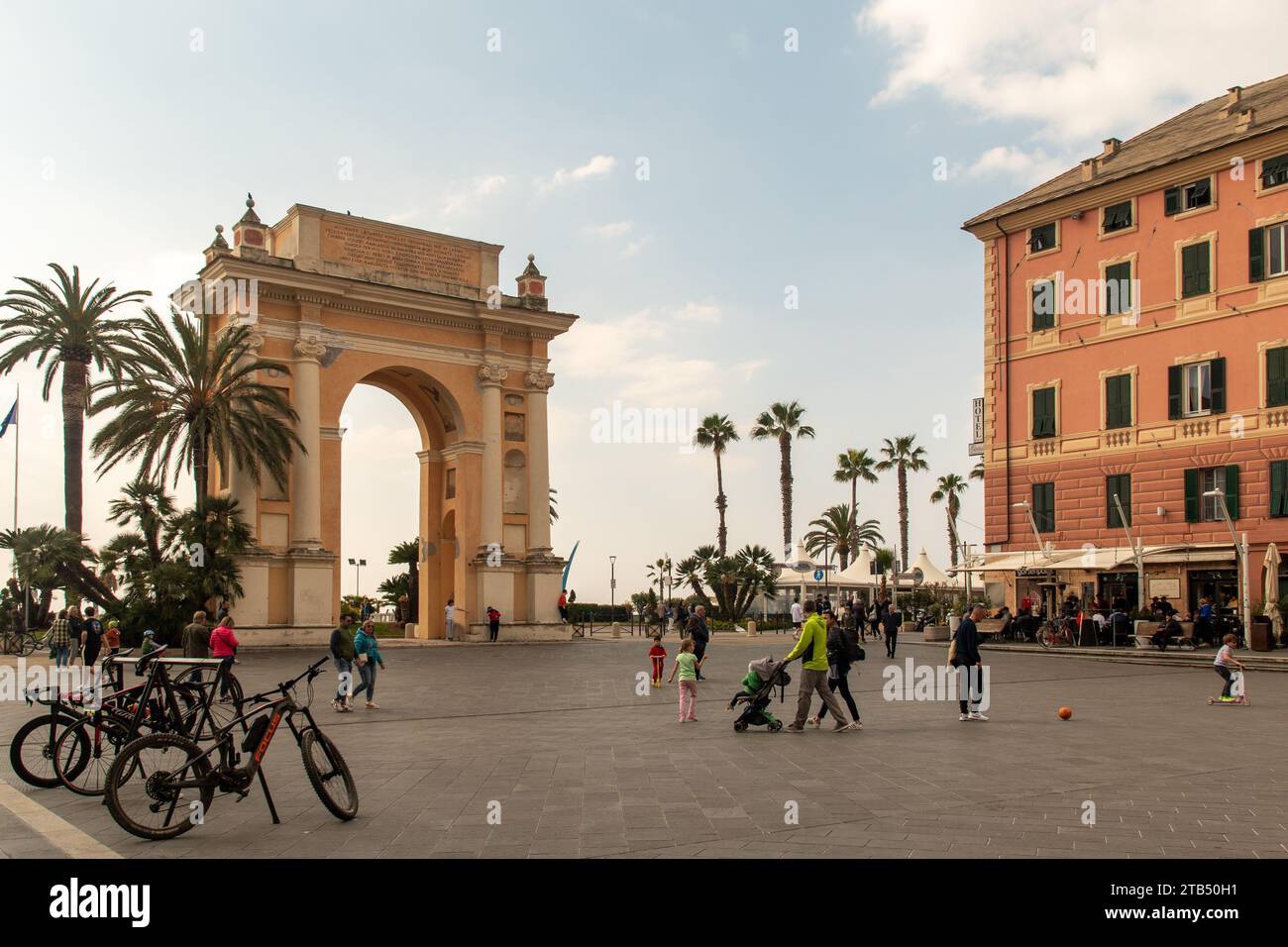 Children playing in Piazza Vittorio Emanuele II with the triumphal arch ...