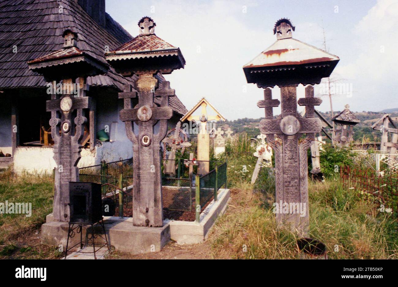 Novaci, Gorj County, Romania, 2001. Old wooden crosses in the cemetery ...