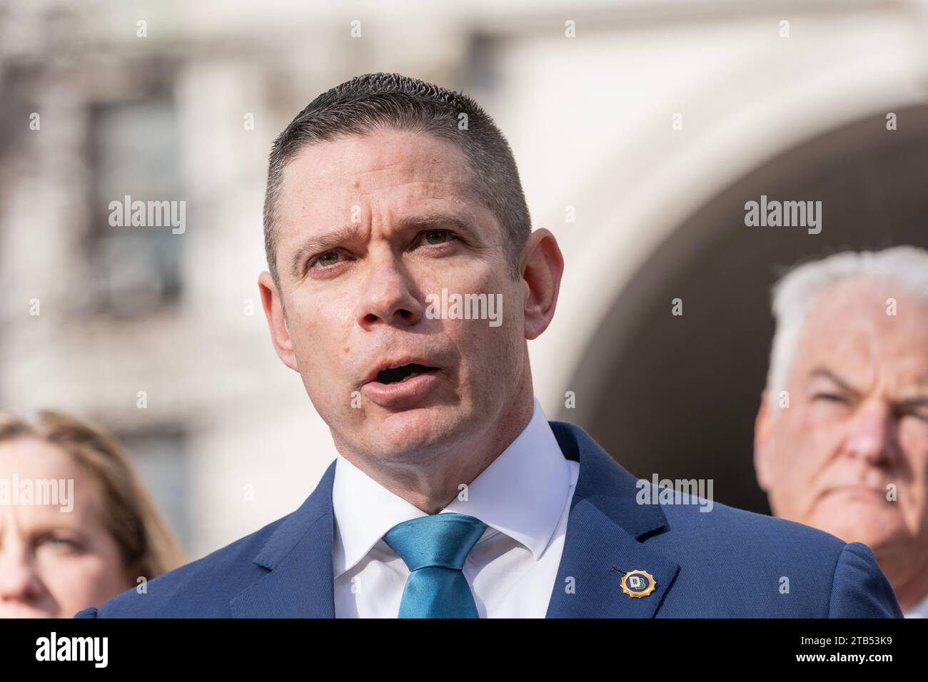 Assistant Chief Jason Savino speaks as Senator Kirsten Gillibrand ...