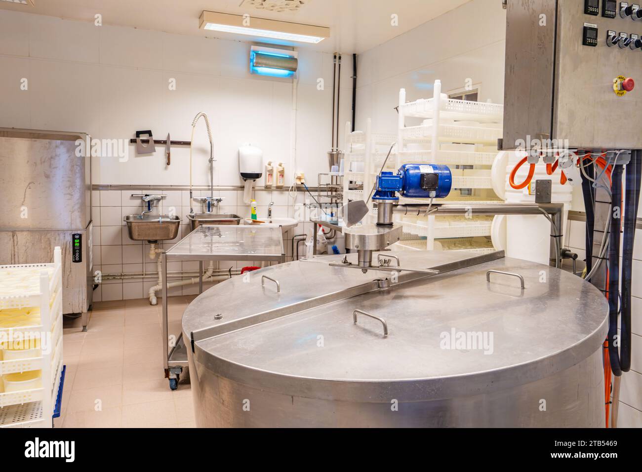 Small Cheese Factory Interior with Specialized Machinery and Tools for ...
