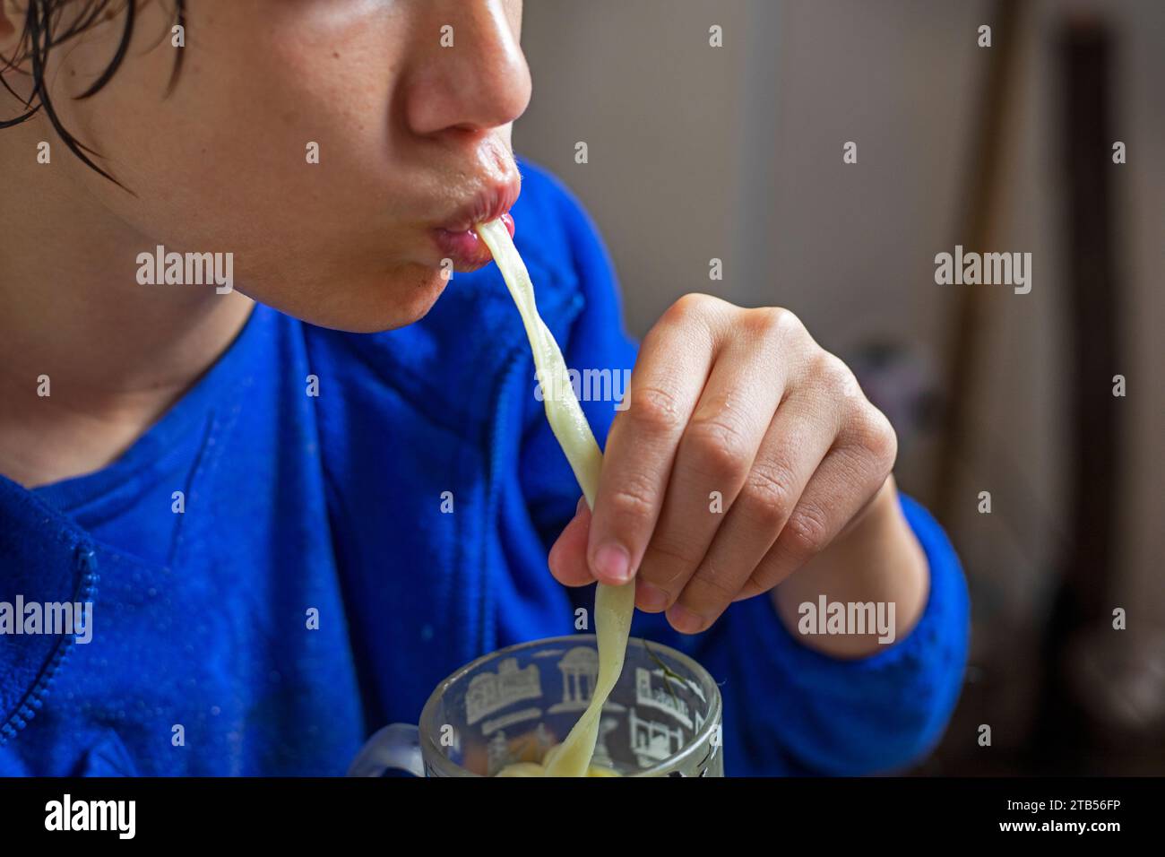 Putting food into his mouth hi-res stock photography and images - Alamy