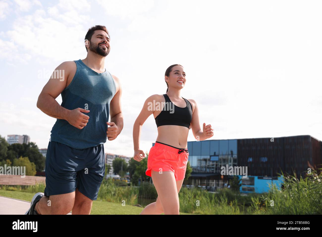 Couple running outdoors hi-res stock photography and images - Alamy