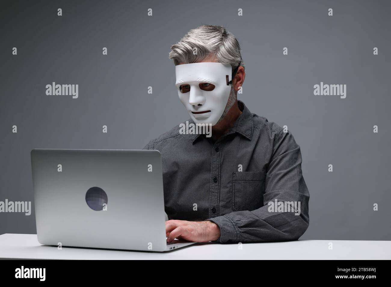 Hacker hide face working computer hi-res stock photography and images ...