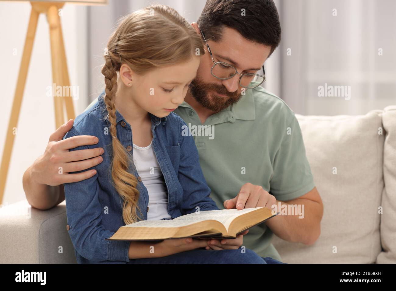 Girl reading holy bible home hi-res stock photography and images - Alamy
