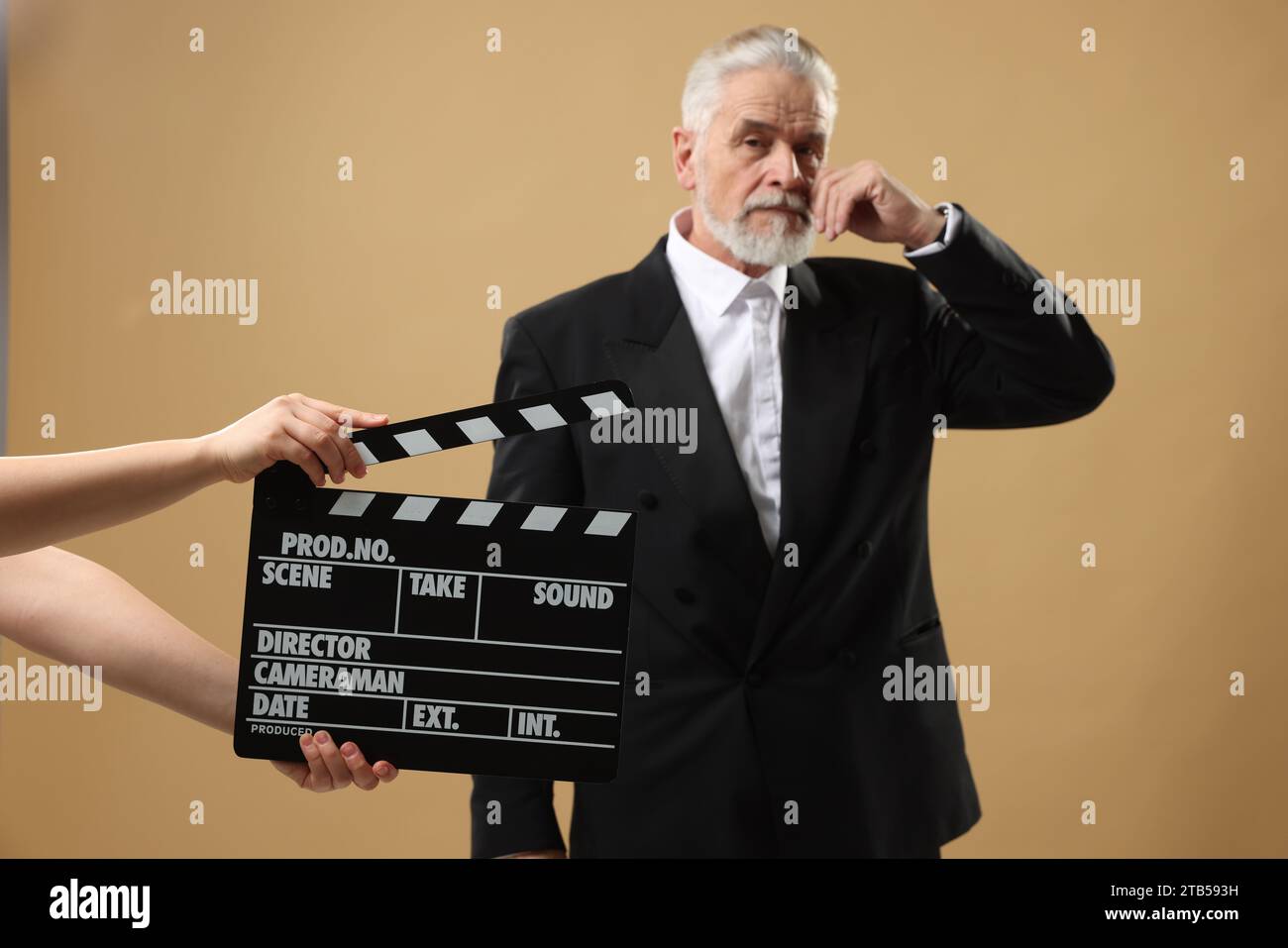 Senior actor performing role while second assistant camera holding ...