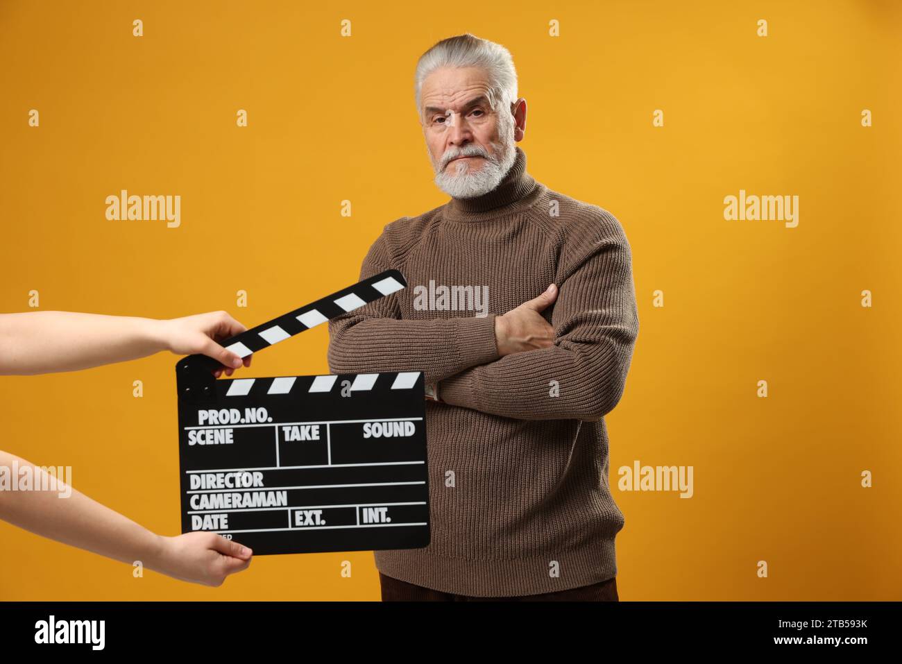 Senior actor performing while second assistant camera holding ...
