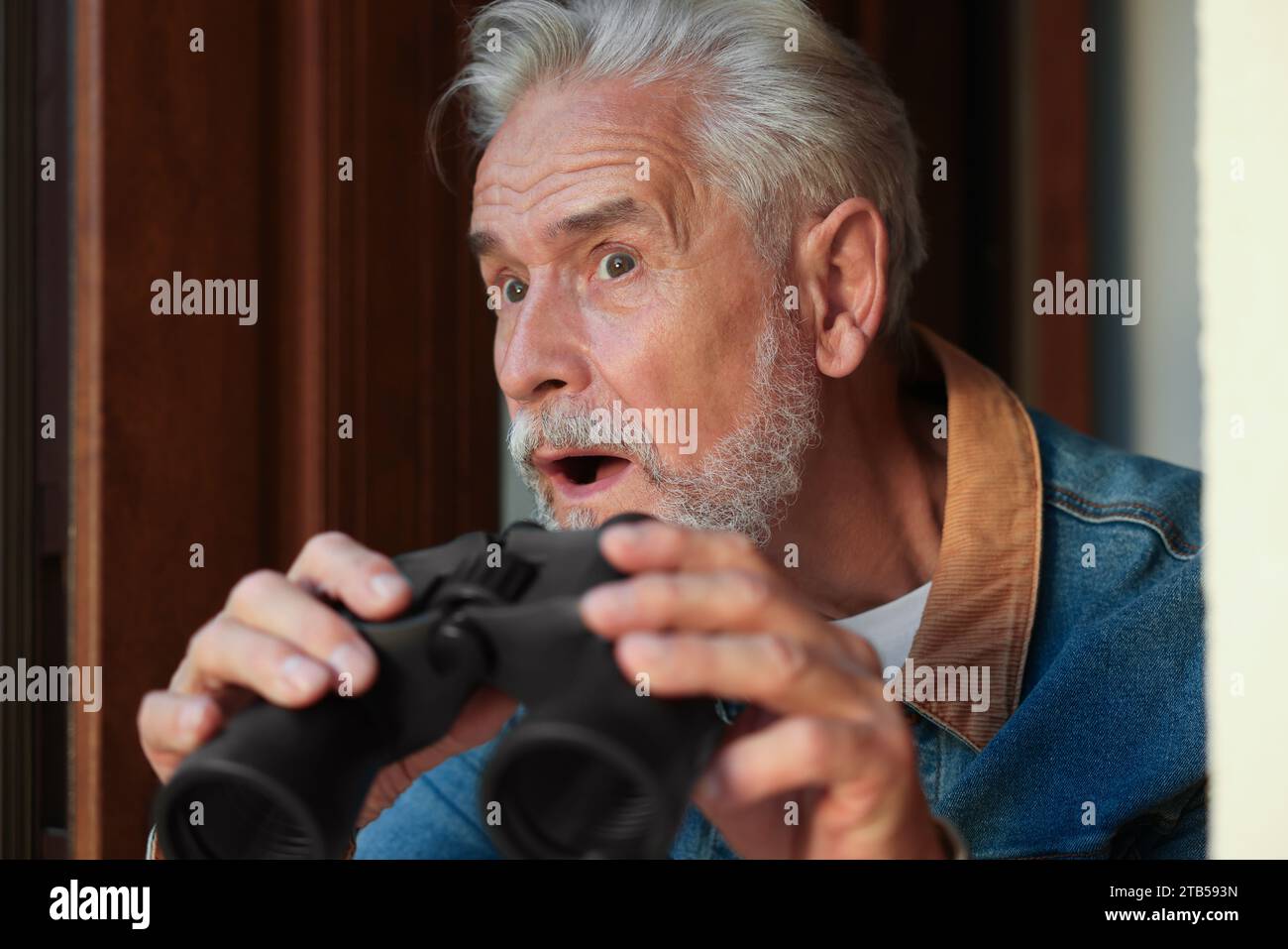 Concept Of Private Life Curious Senior Man With Binoculars Spying On