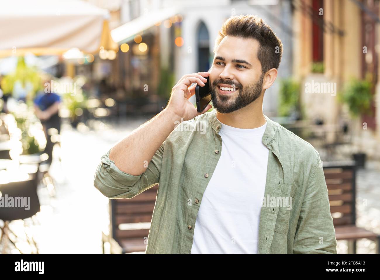 Portrait of man tourist having remote conversation communicate speaking ...