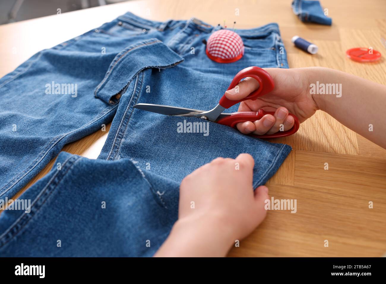 Woman scissors jeans hi-res stock photography and images - Alamy
