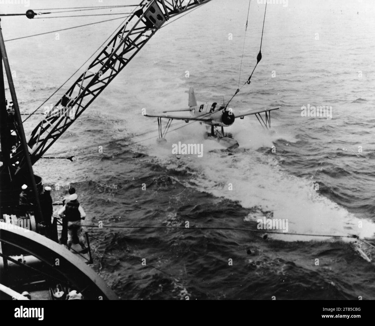 Vought OS2U Kingfisher is recovered by USS Stevens (DD-479) during ...