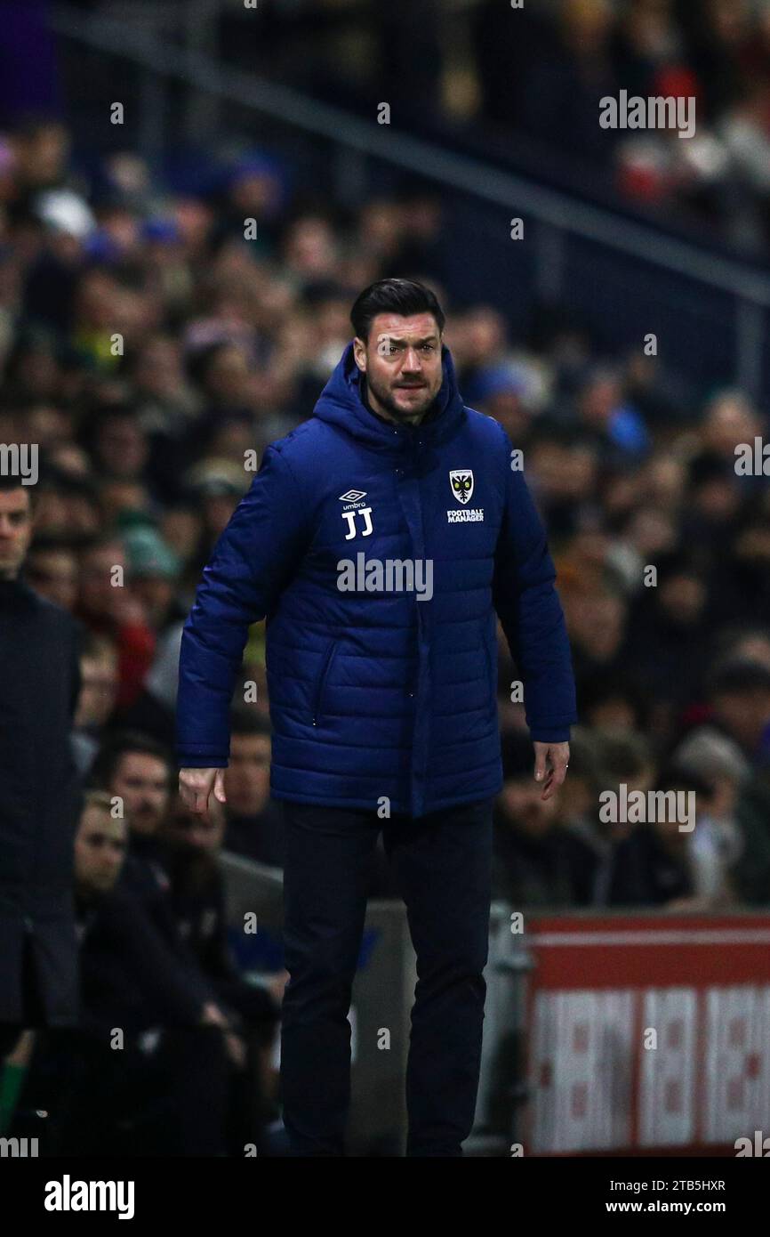 Wimbledon, UK. 4th December 2023.Johnnie Jackson Manager of AFC ...