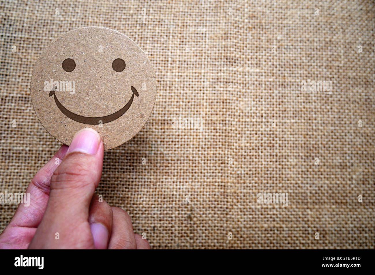 Hand holding happy smile face card. Concept of happiness, mental health ...