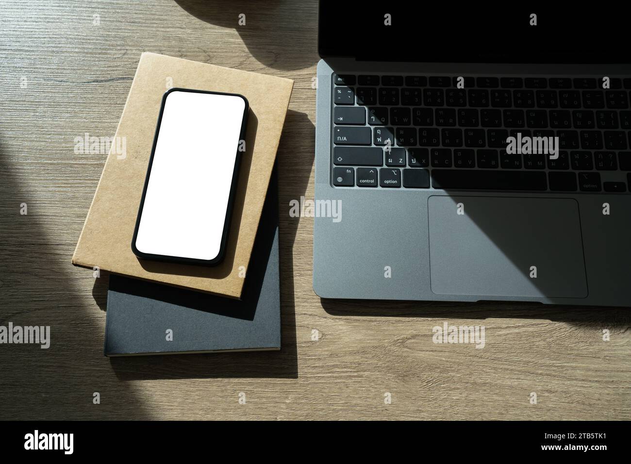 smart mobile phone blank screen display device on table Mockup for the ...