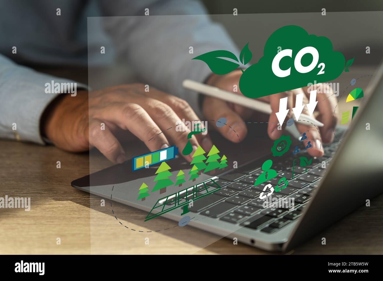 Businessman working computer to reduce CO2 depicting the issue of ...