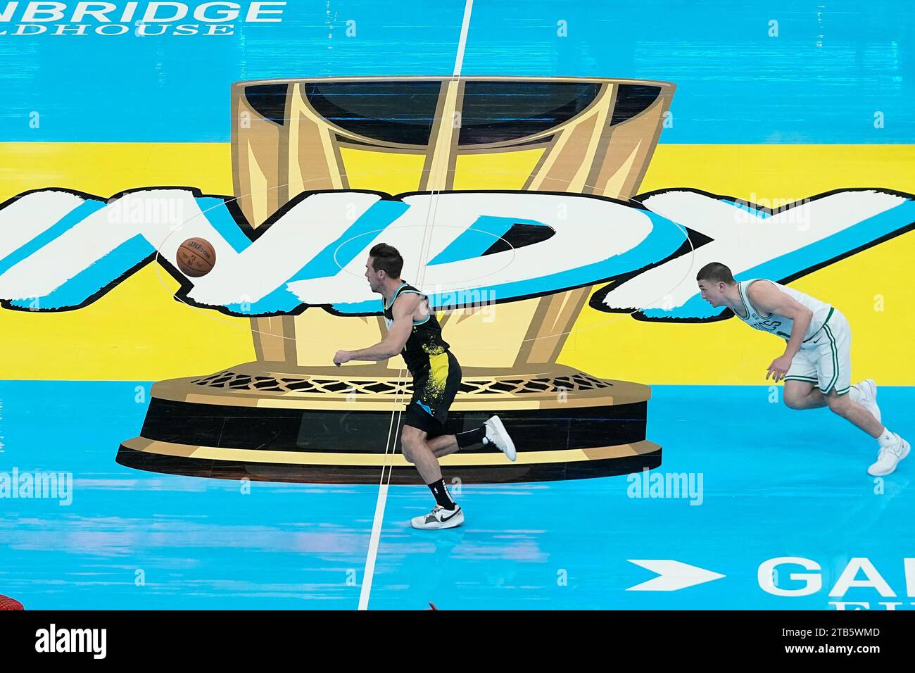 Indiana Pacers' T.J. McConnell, left, leads a fast break against Boston ...