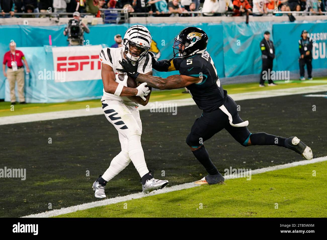 Jacksonville Jaguars safety Andre Cisco (5) pushes Cincinnati Bengals ...