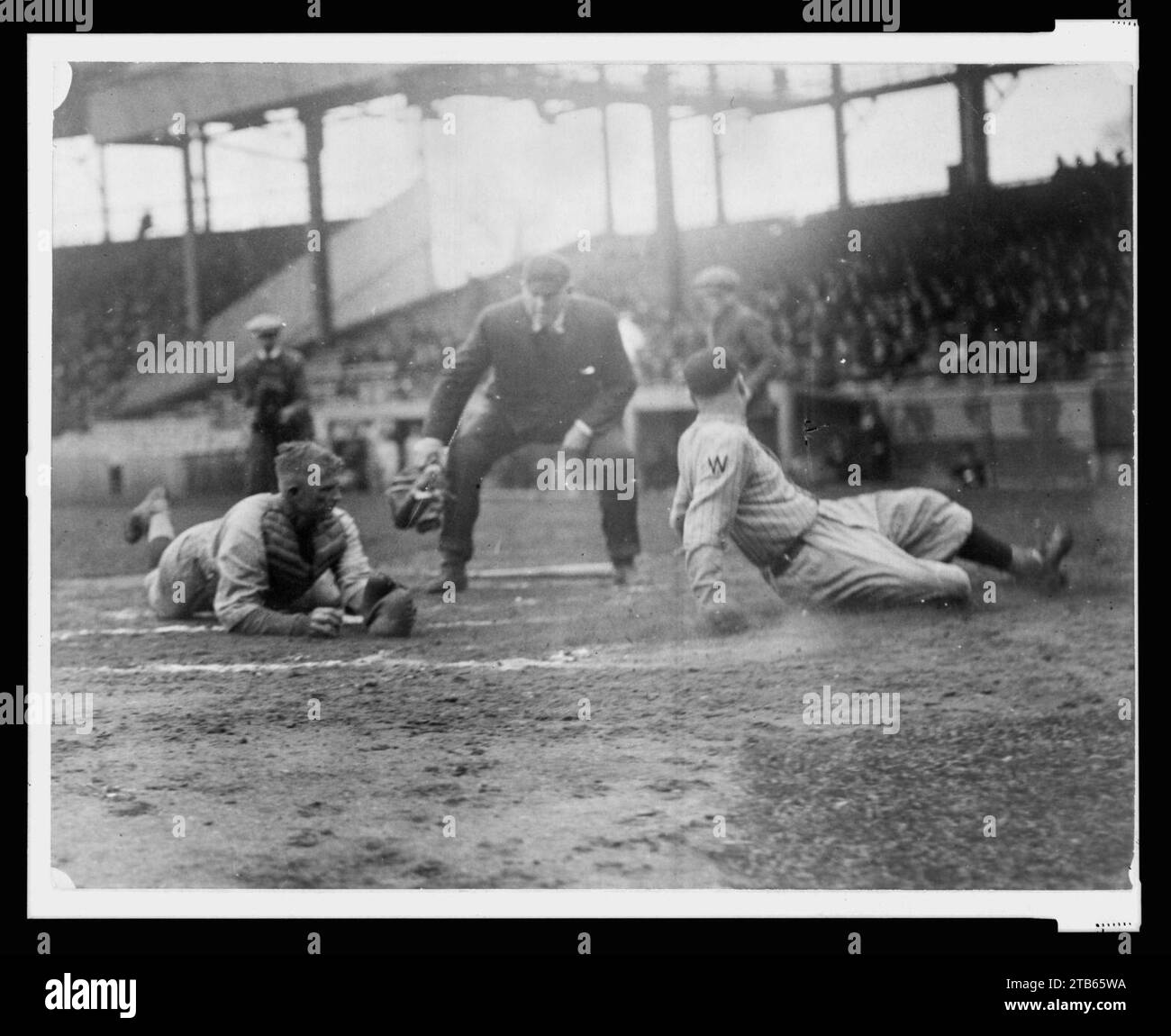 Waiting for the umpire to make the call as Washington ball player, Joe ...