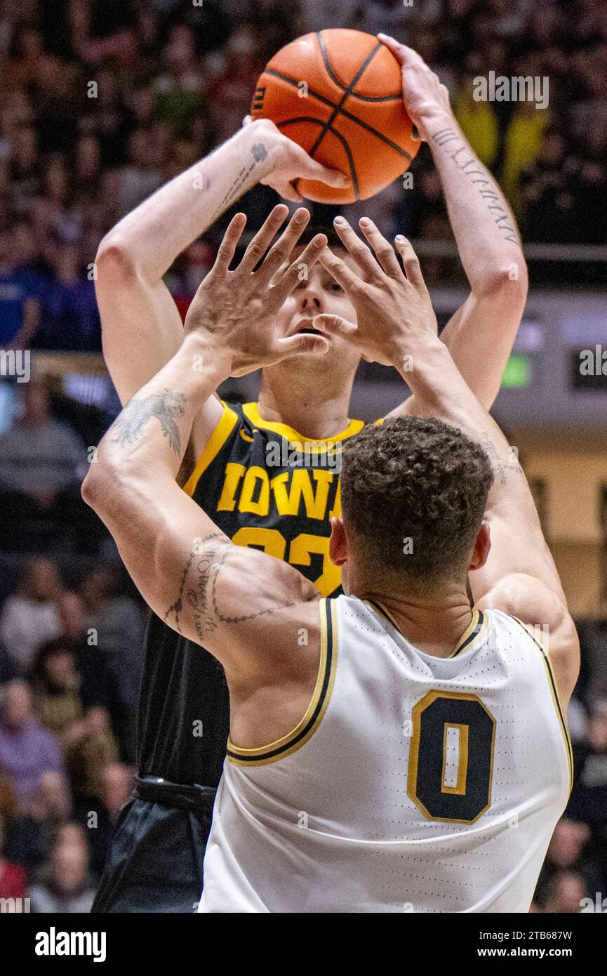 Iowa forward Patrick McCaffery (22) shoots while being defended by ...