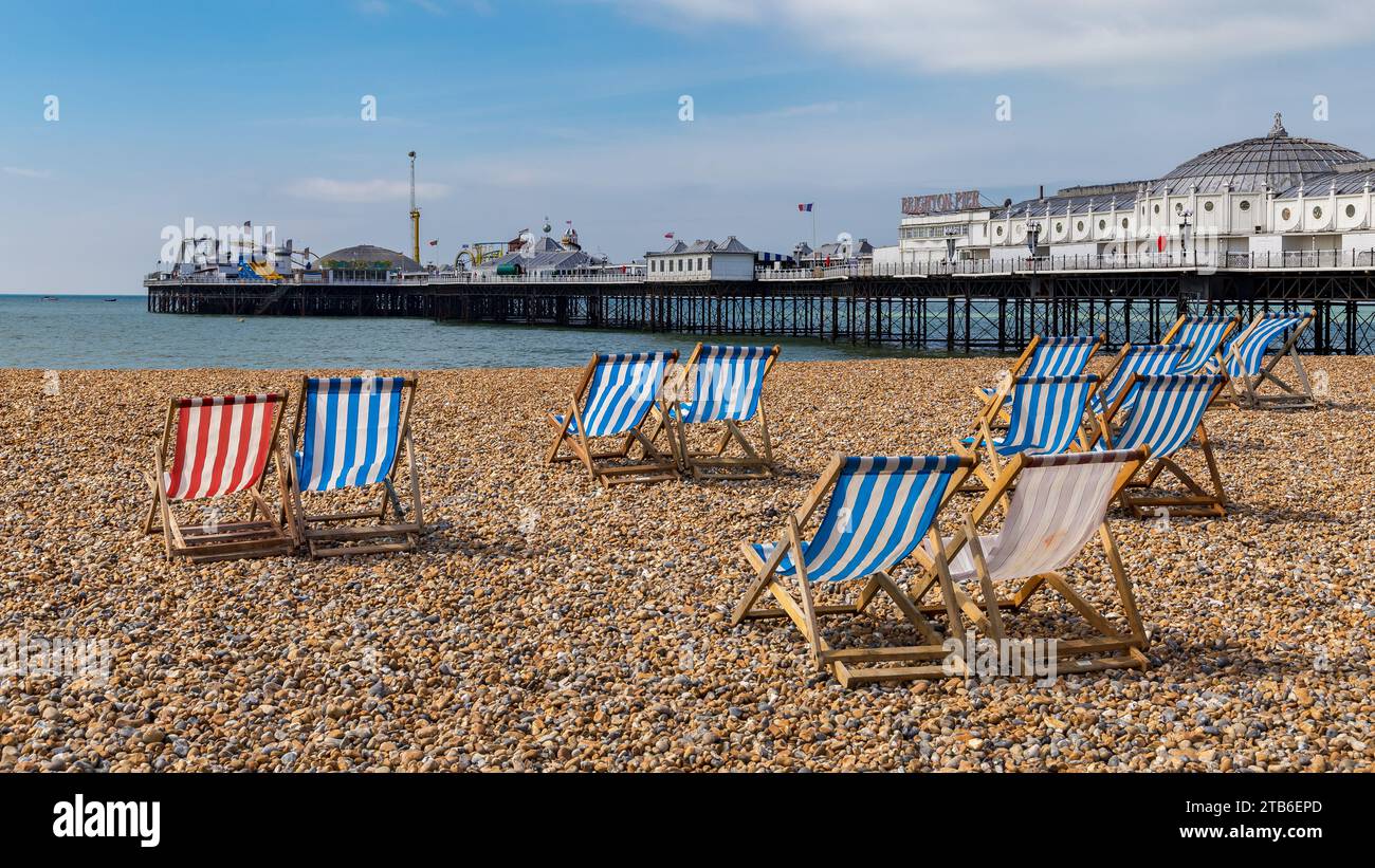 Deck Chairs on the beach with the Palace Pier in the background ...