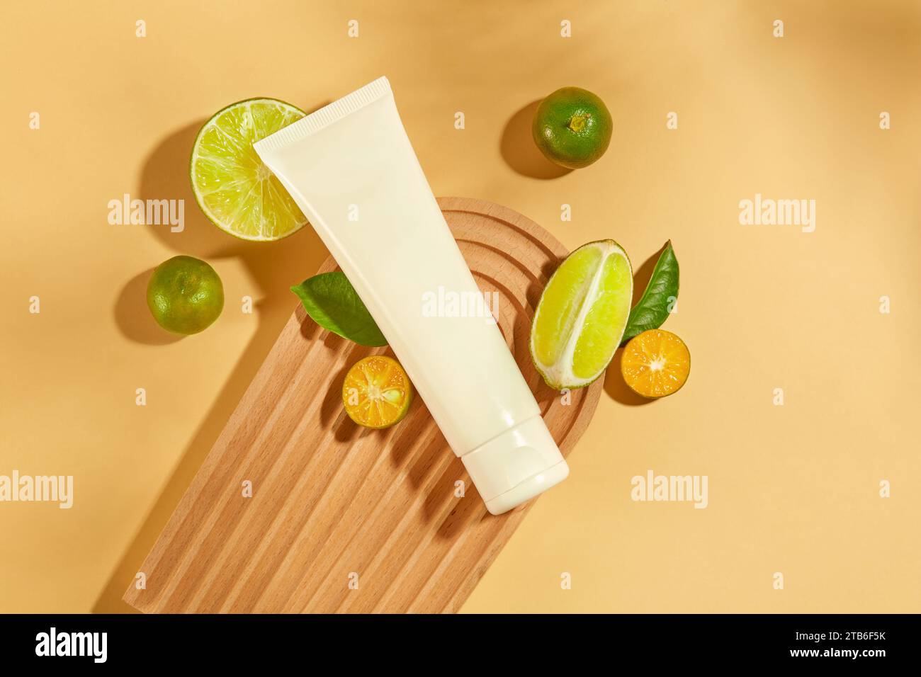An unlabeled cosmetic tube is placed on a dome-shaped platform ...