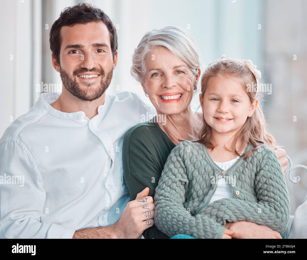 Father, grandmother and girl with smile in portrait, hug and care with ...