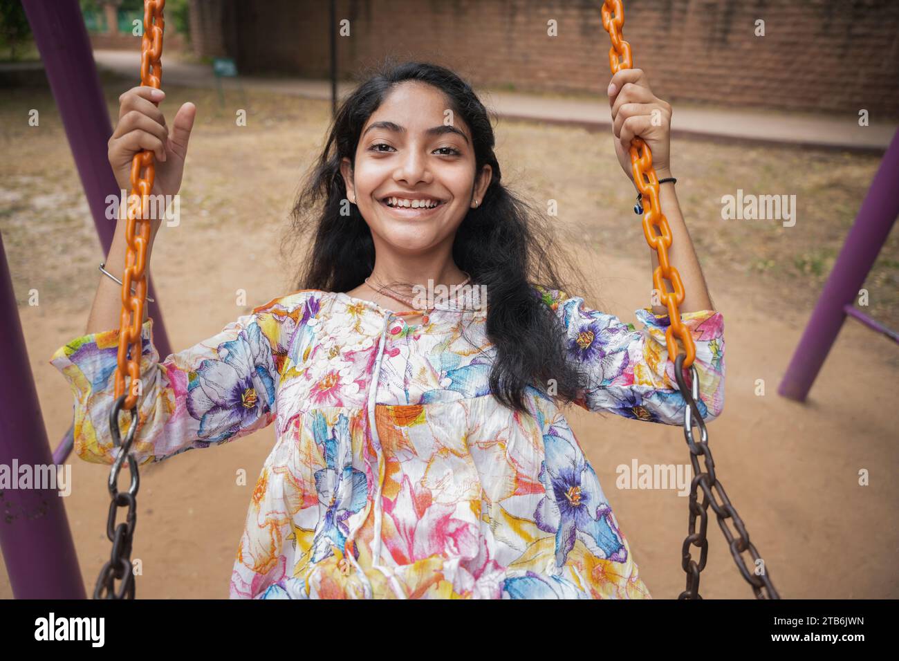 Happy Indian Girl Having Fun On A Swing On Sunny Day Healthy Summer