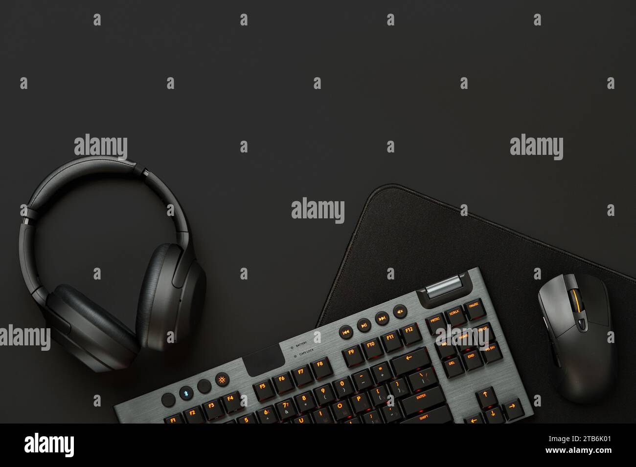 Headphones, computer mouse and keyboard on black background Stock Photo ...