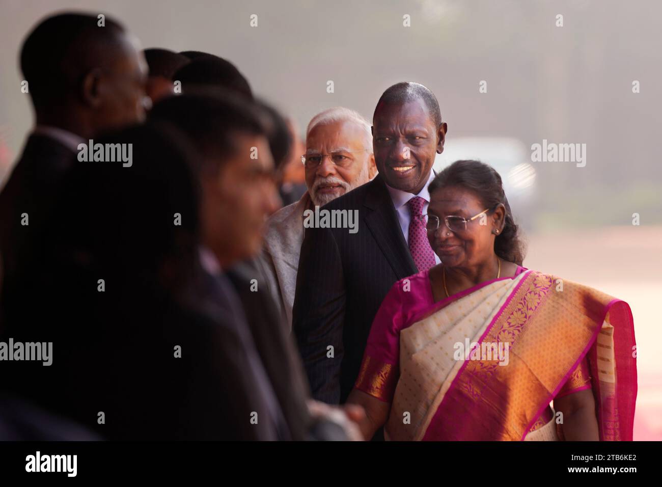 Visiting Kenyan President William Ruto, center, introduces his ...
