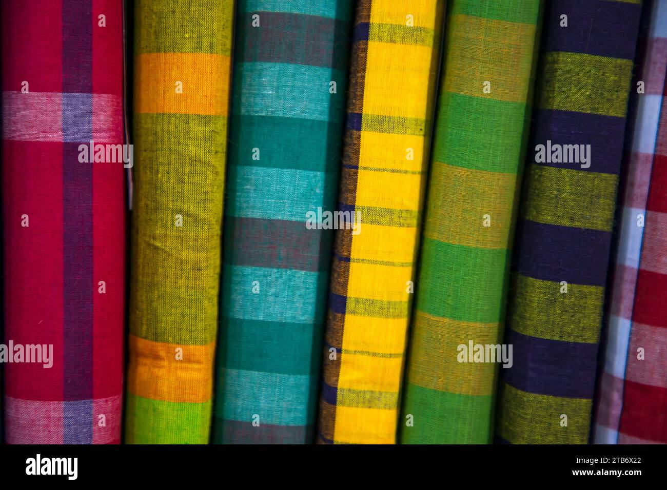 Multicolor Traditional Bangladeshi men's wear lungi folded on a rack in ...