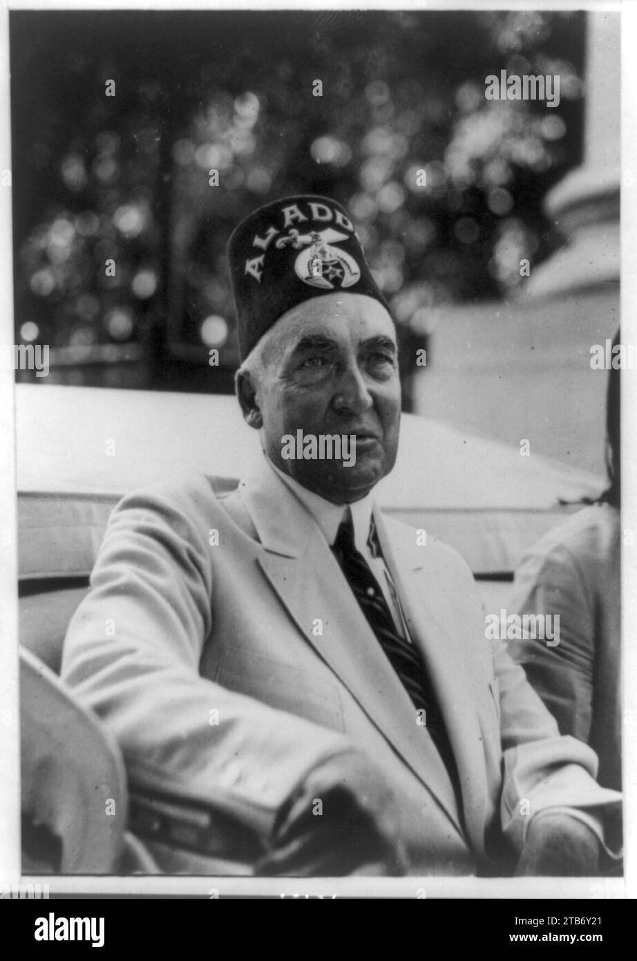 Warren G. Harding, half-length portrait, seated in vehicle, facing ...