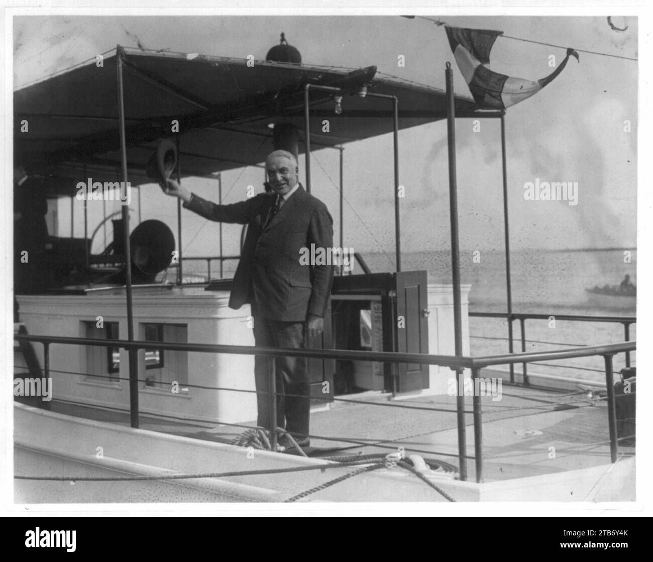 Warren Harding, three-quarters length, standing in auto, facing ...