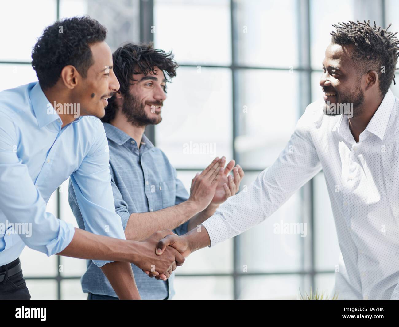 Successful Business Collaboration: Executives Greet with Handshake in ...
