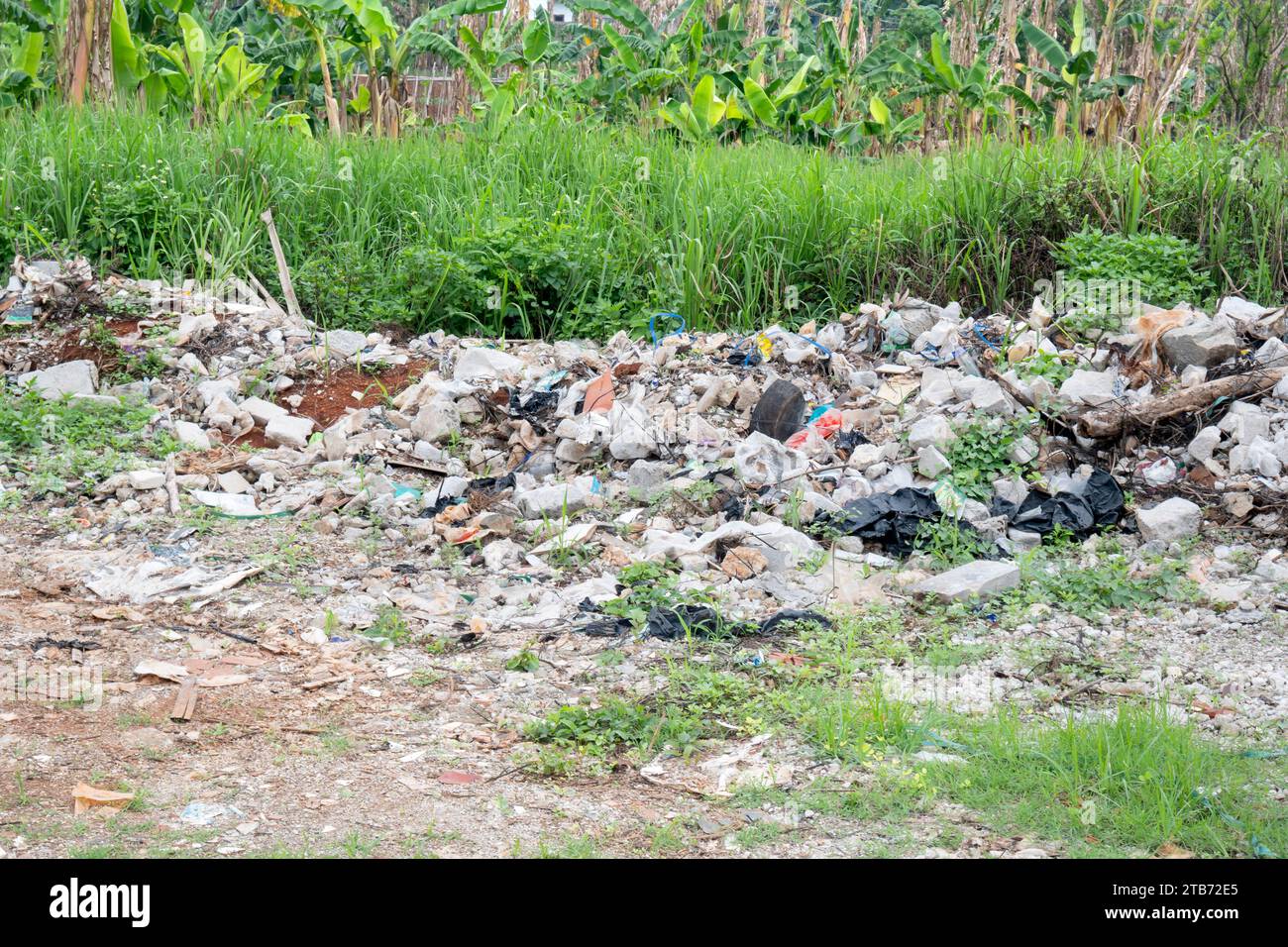 Rubbish on the ground. Illegally throwing garbage Stock Photo - Alamy