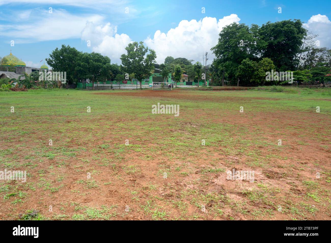 Football field with blue sky background Stock Photo - Alamy
