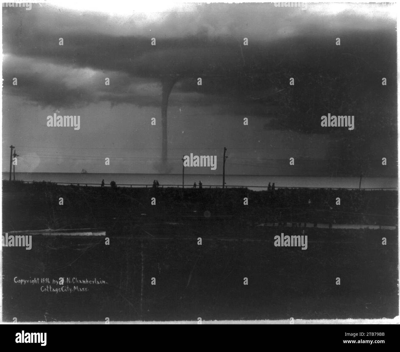Waterspout, Vineyard Sound, Mass. People standing and walking along ...