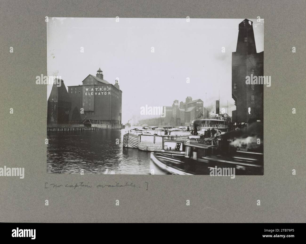 Watson grain elevator, Buffalo Harbor, boats in foreground and Bennett ...