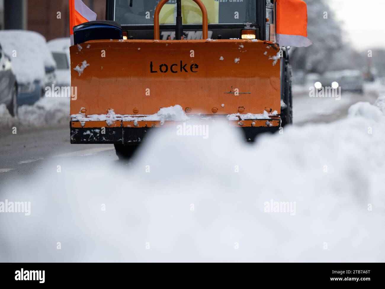 Munich, Germany. 05th Dec, 2023. A snow plow drives over a road. Snow ...